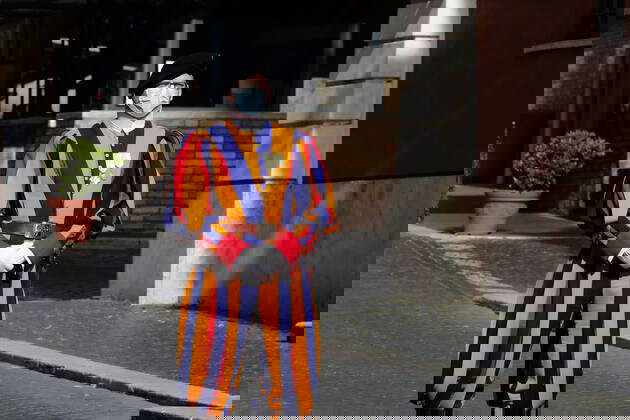 Vatican City, Holy See - Pontifical Swiss Guards with mask against the ...