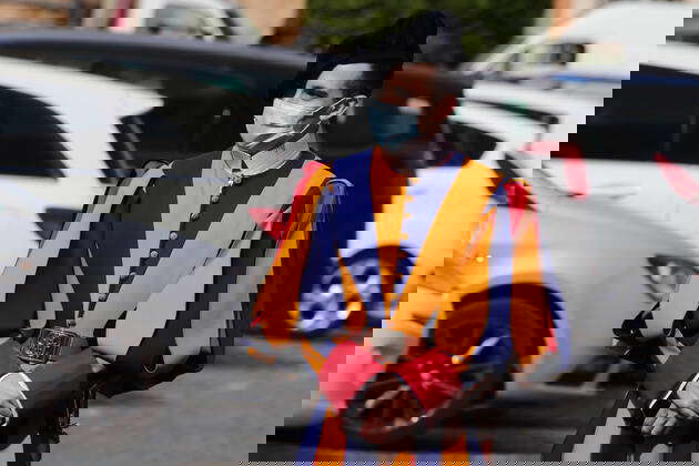 Vatican City, Holy See - Pontifical Swiss Guards with mask against the ...