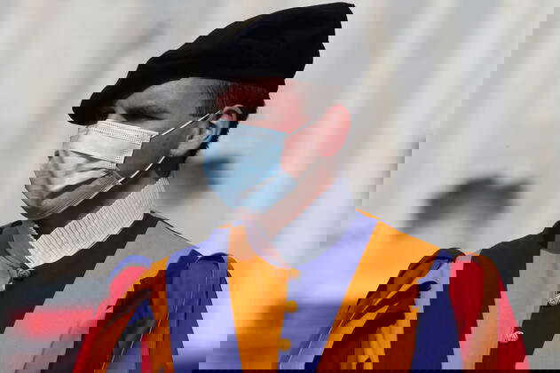 Vatican City, Holy See - Pontifical Swiss Guards with mask against the ...