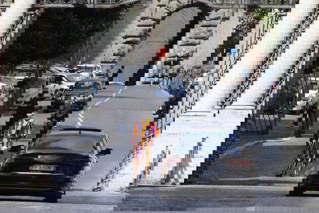 Vatican City, Holy See - Pontifical Swiss Guards with mask against the ...