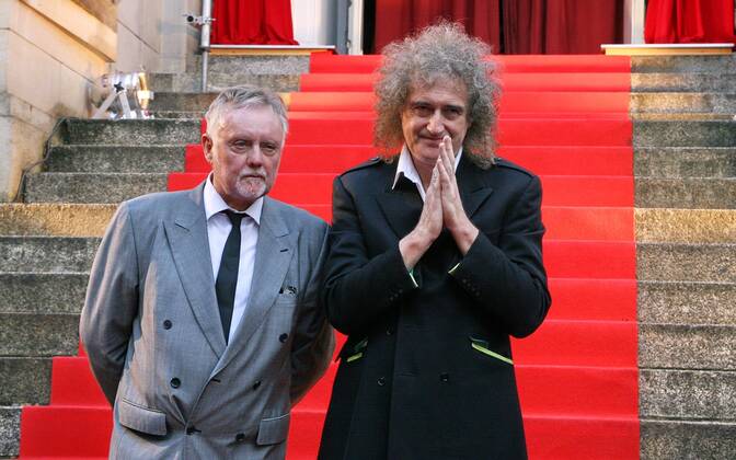 91 Brian May curls Roger Taylor grey suit from Queen as well as Ben ...