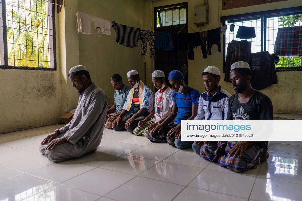 June 27, 2020, Lhokseumawe, Indonesia: Migrant men pray at a temporary ...