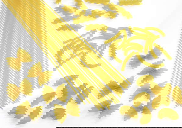 Shells, Macaroni, Spaghetti and Twisted Pasta Against White Background ...