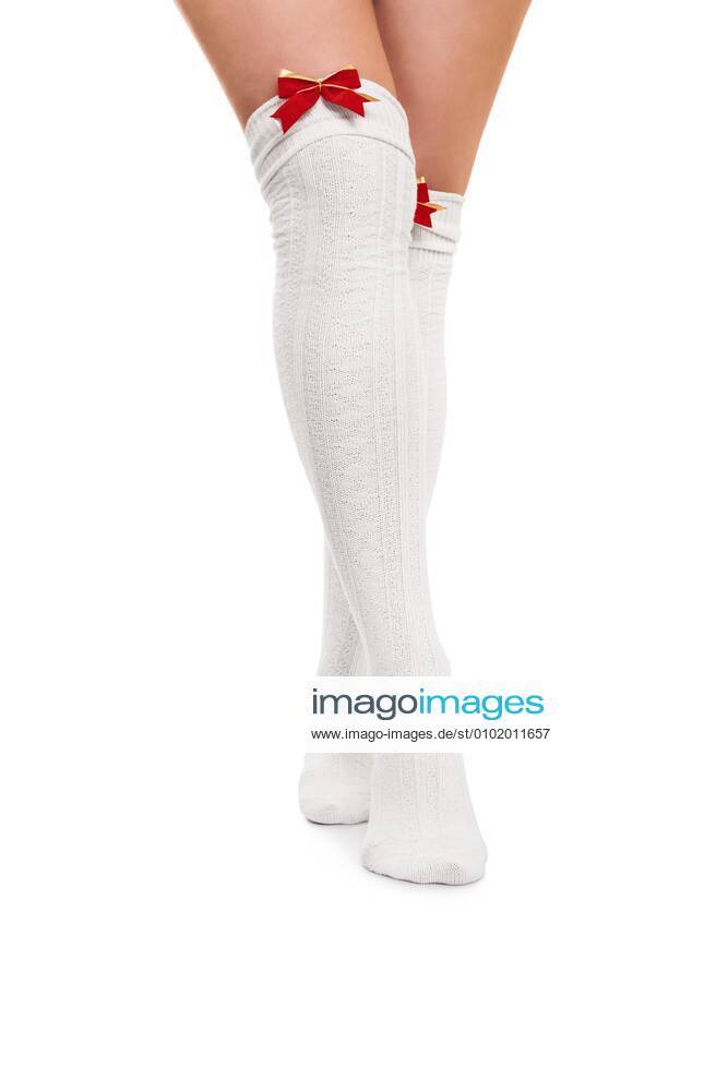 Female Legs In White Stockings With Red Bow Ties