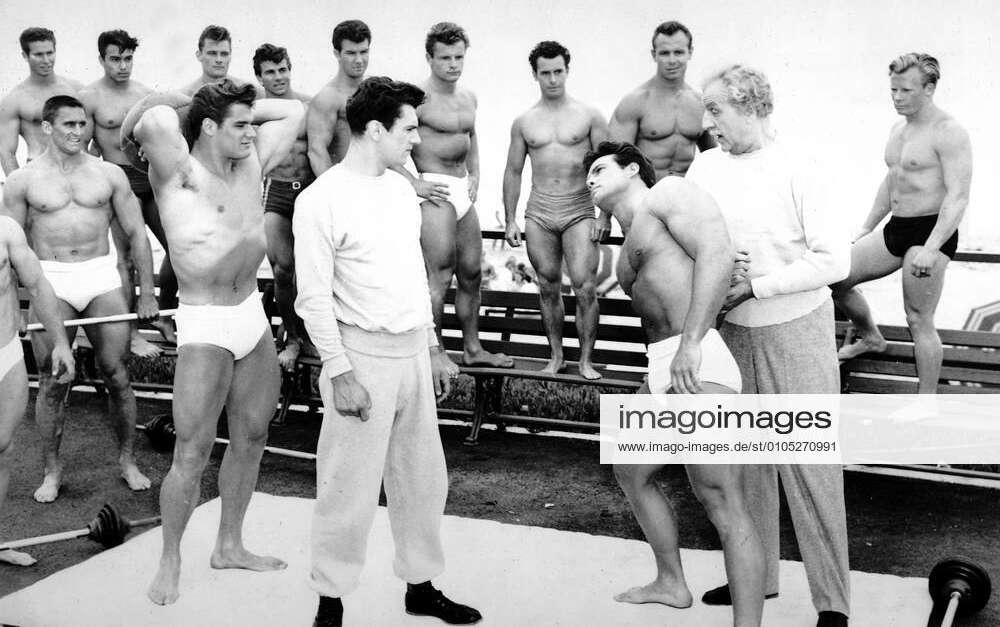 ATHENA EDMUND PURDOM , STEVE REEVES arm twisted , LOUIS CALHERN arm ...