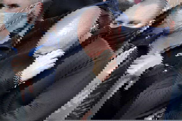 MOSCOW, RUSSIA - : People attend a funeral of Russian neo-Nazi activist ...