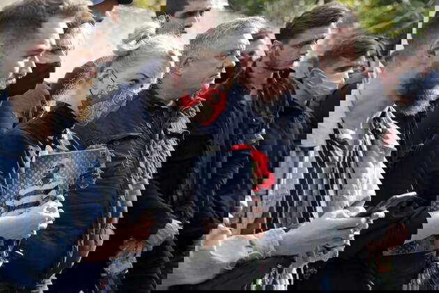 MOSCOW, RUSSIA - : People attend a funeral of Russian neo-Nazi activist ...