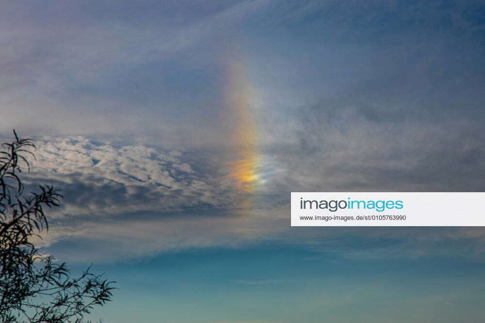 Solar halo, northern parhelion shining through cirrus clouds, Germany ...