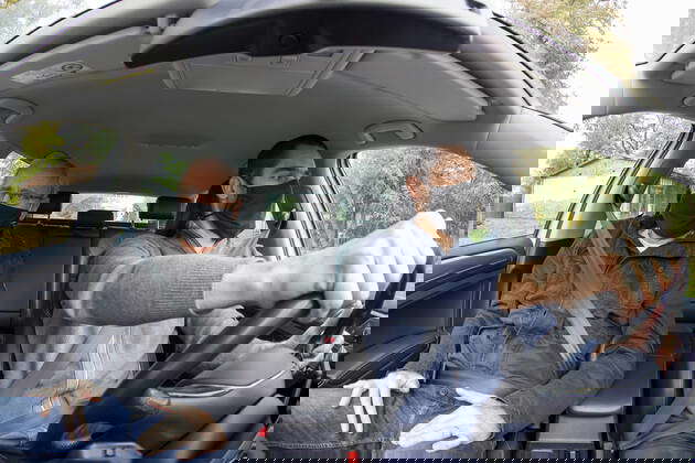 Driver with passenger wear a face mask in a car on in Zlin, Czech ...