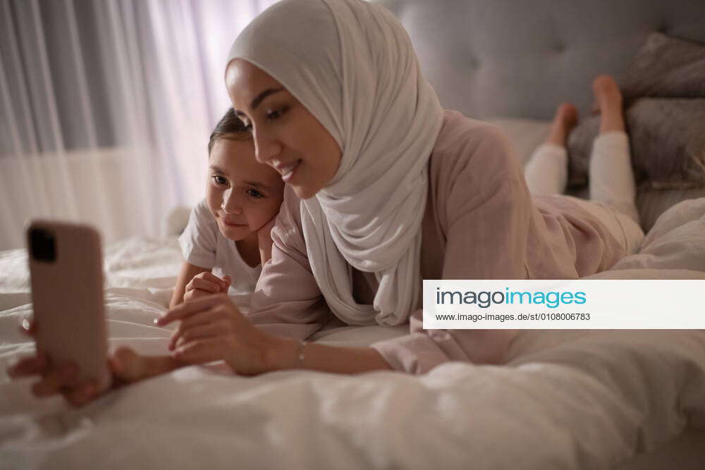 Muslim woman and girl talking with father online Kazan, Republic of ...