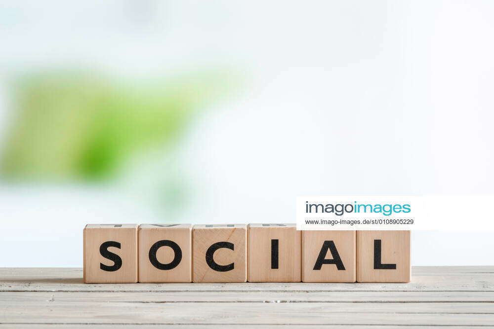 Social sign on a wooden table Social sign made of cubes on a wooden ...
