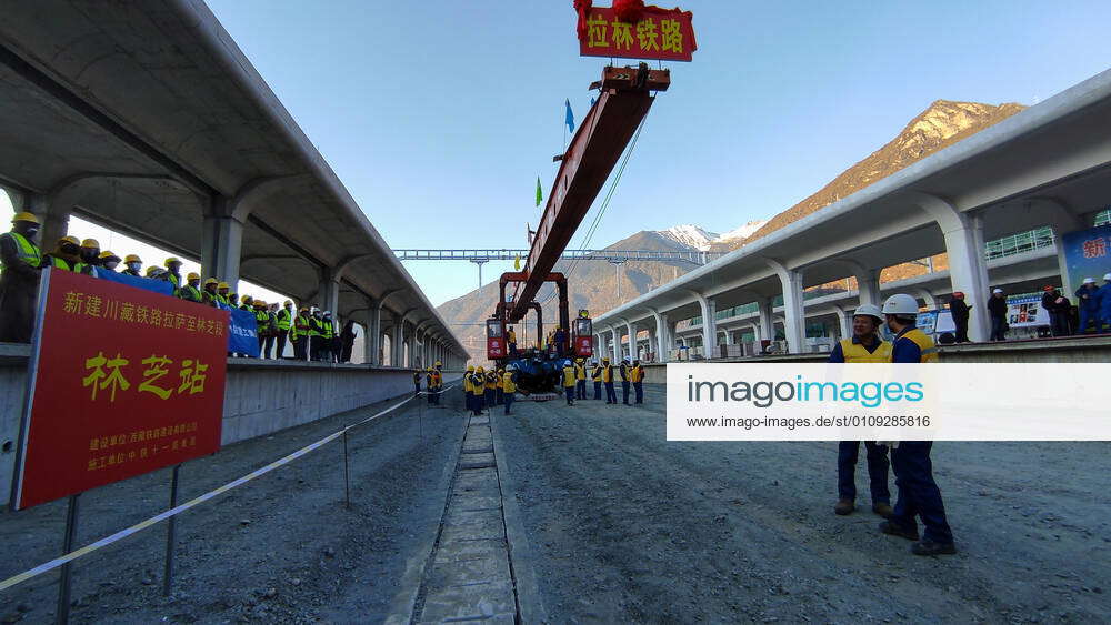 NYINGCHI, CHINA - DECEMBER 31: Construction workers lay the last tracks ...