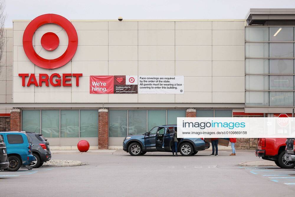 USA: A family loads a new television they purchased on Black at Target ...