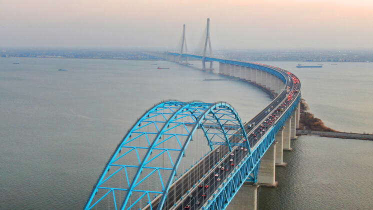NANTONG, CHINA - FEBRUARY 17: Aerial view of vehicles being driven ...
