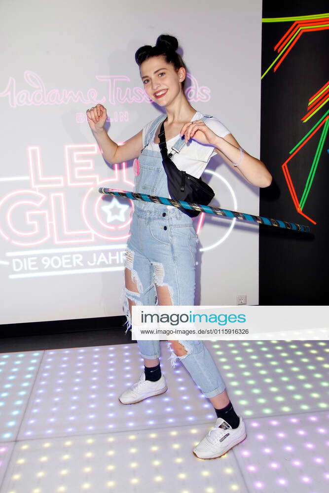 Fata Hasanovic dances with a hula hoop at the big 90s neon bash at ...