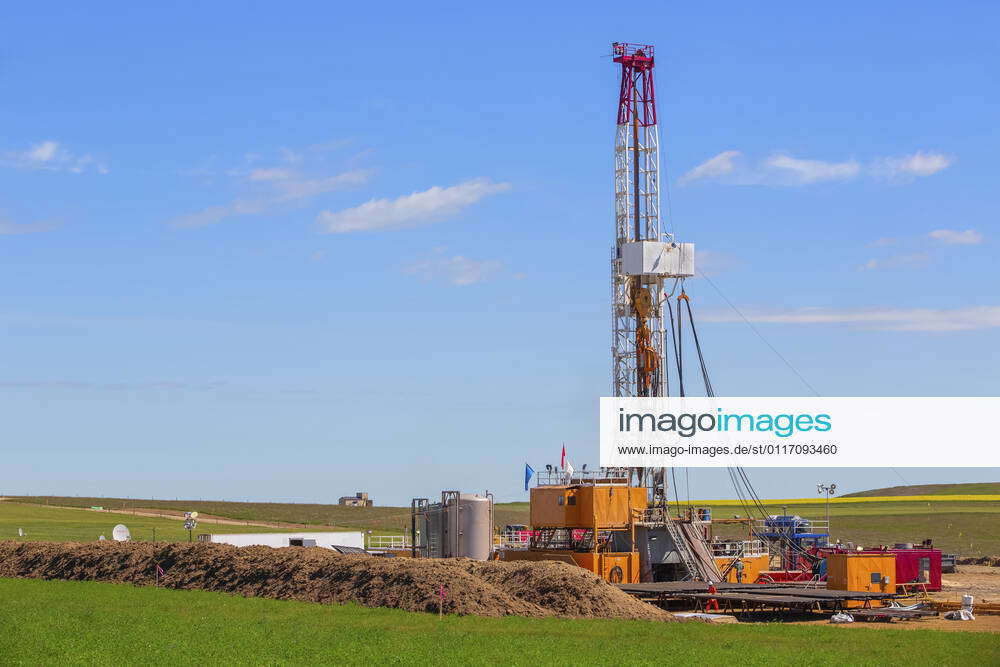 Triple rig drilling equipment at the site of an oil well; Alberta ...
