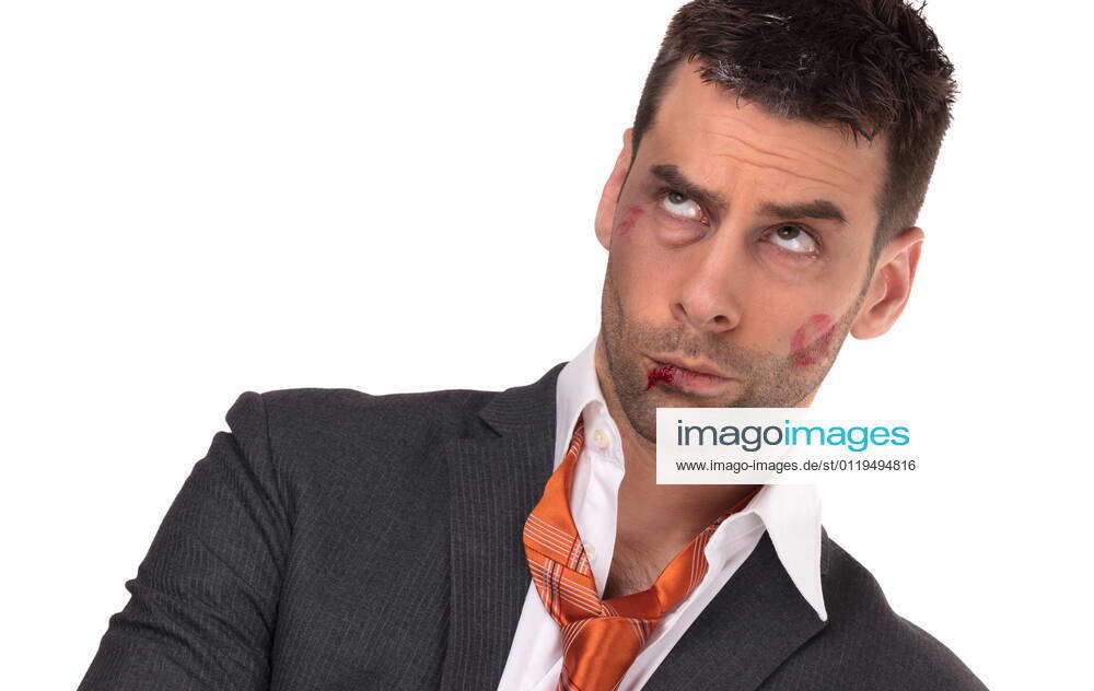 Close up of a businessman with bloody lip, beaten and bruised, isolated