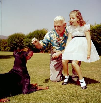 George Brent, with his daughter Suzanne, 6, and their dog Stormy, at ...