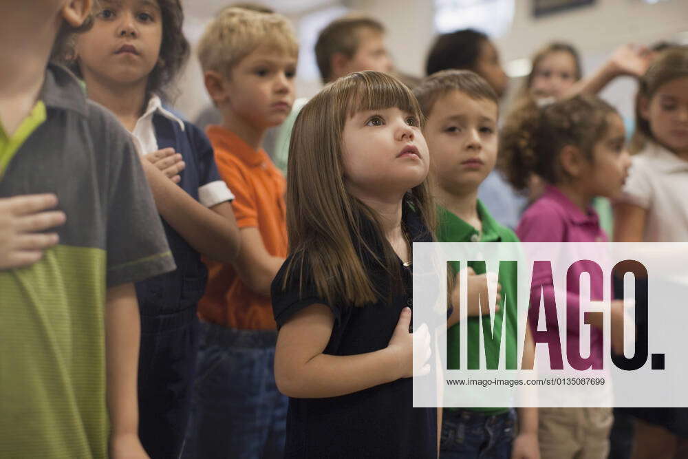 Children reciting Pledge of Allegiance in school