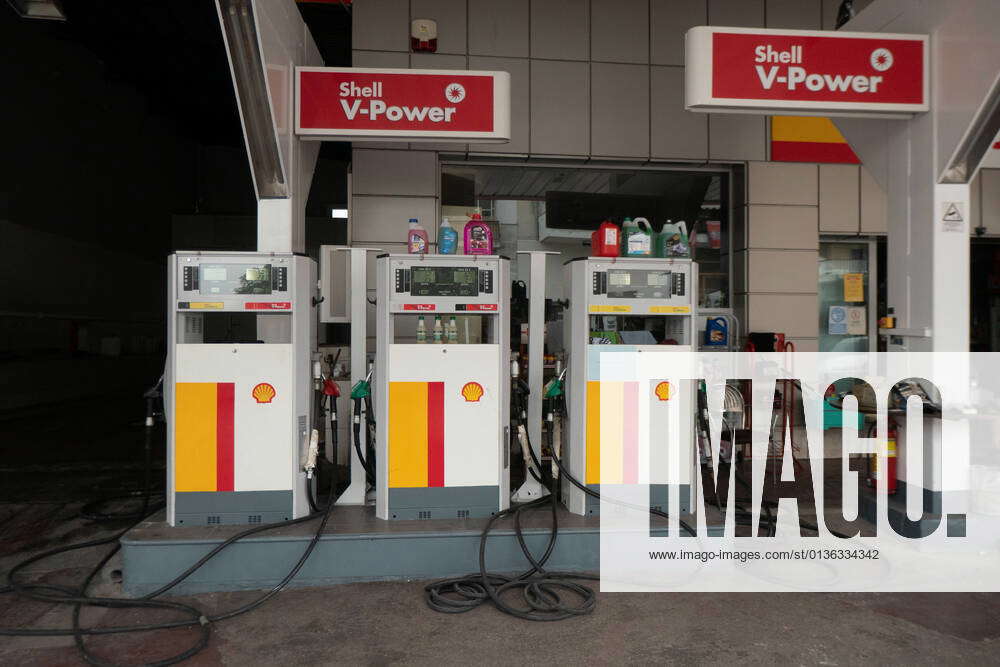 Shell Gas Station Filling nozzles and pumps at a Shell gas station in ...