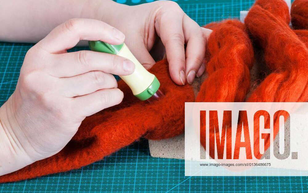 Craftsman binding fibers with felting punchproperty released