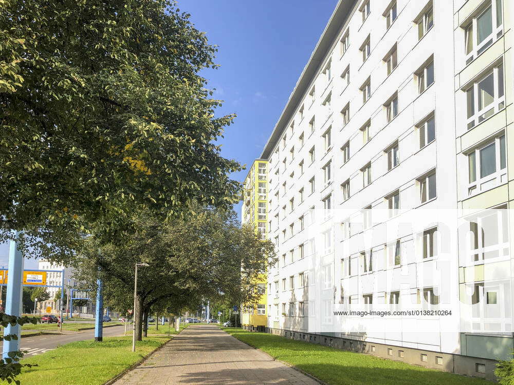 wide sidewalk in front of DDR prefabricated building DDR town planning ...
