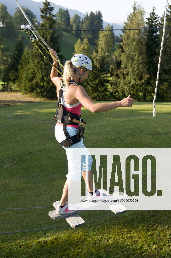 High Ropes Course Good-humoured young people spend an afternoon in the ...