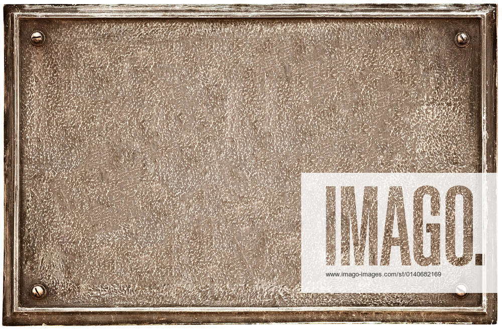 An old cast-iron plaque on the wall