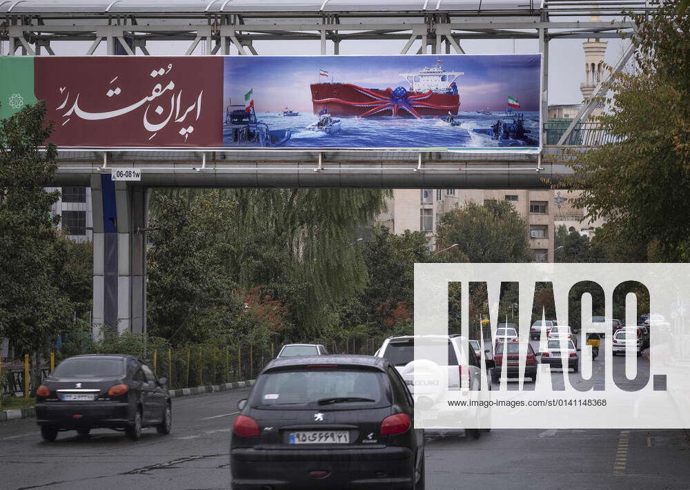 Anti-U.S. Billboards In Tehran Vehicles drive along an avenue as an ...
