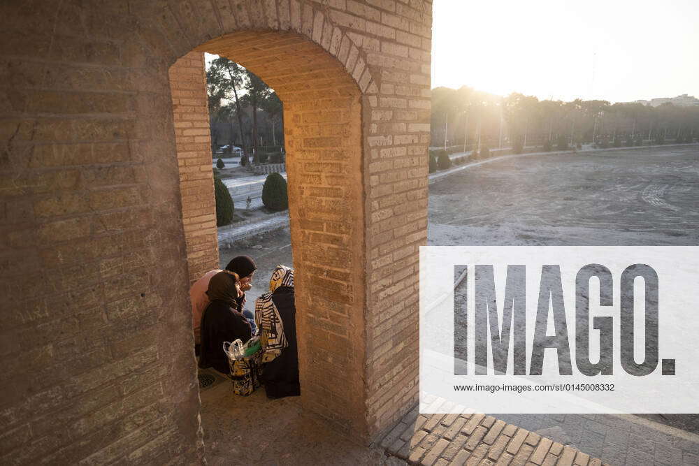 Dried-up Zayandeh Rud River In Isfahan Iranian women sit on the Khaju ...