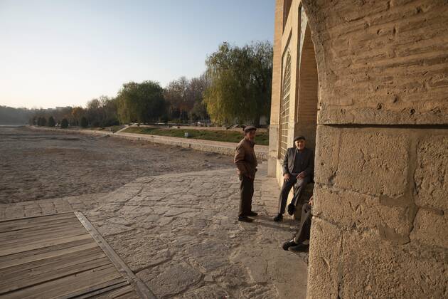 Dried-up Zayandeh Rud River In Isfahan Iranian women sit on the Khaju ...