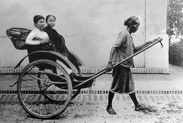 Rickshaws are a mode of human-powered transport: a runner draws a two ...