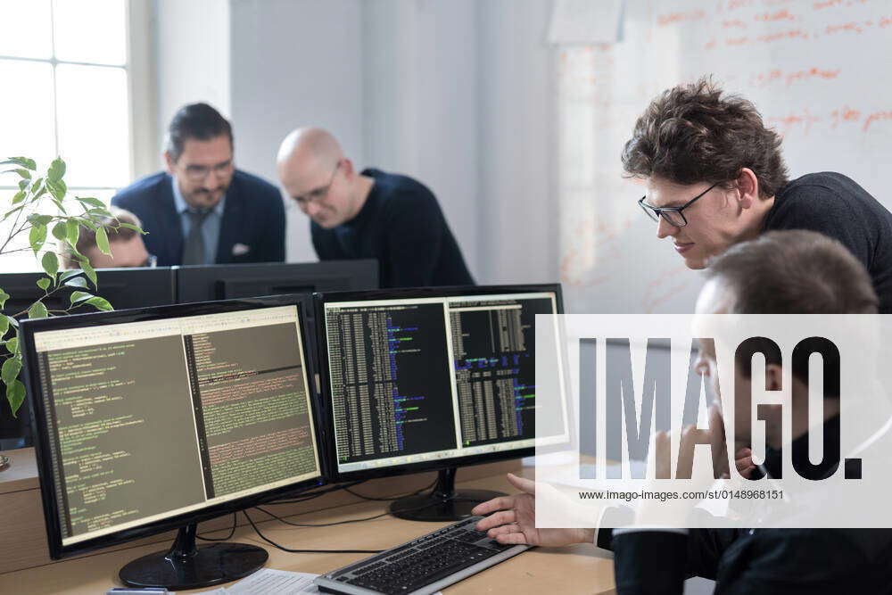 Startup business problem solving. Software developers working on ...