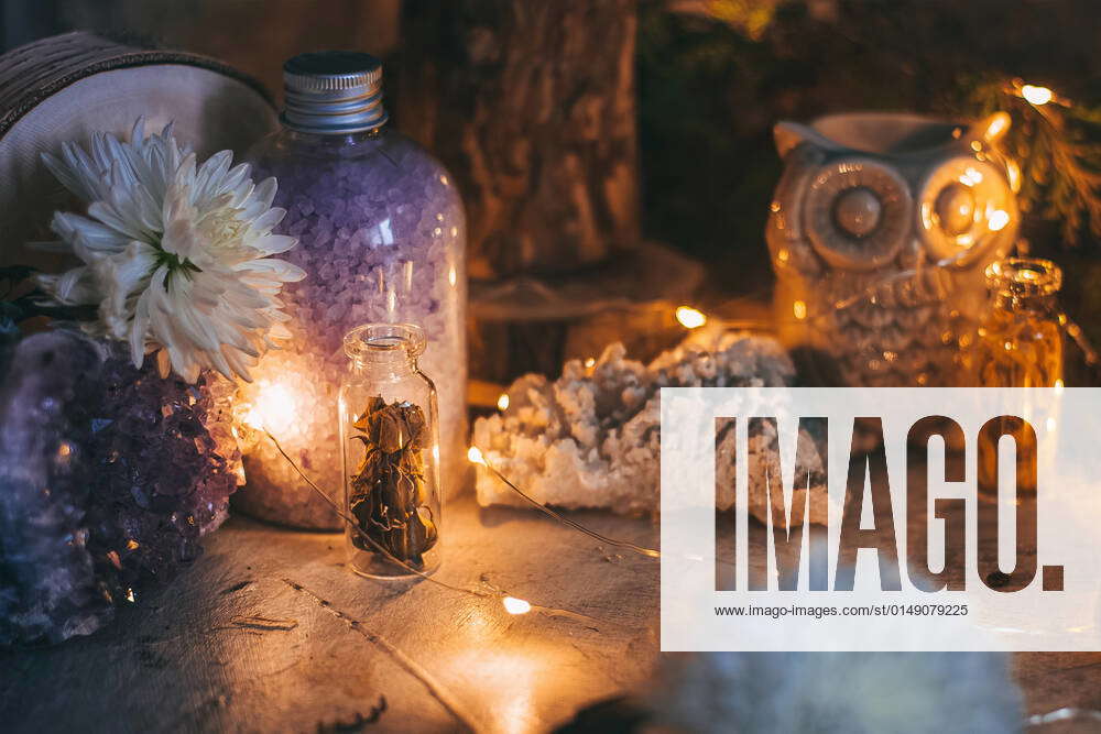 Mysterious halloween scene, witchcraft practicing, ritual candles ...