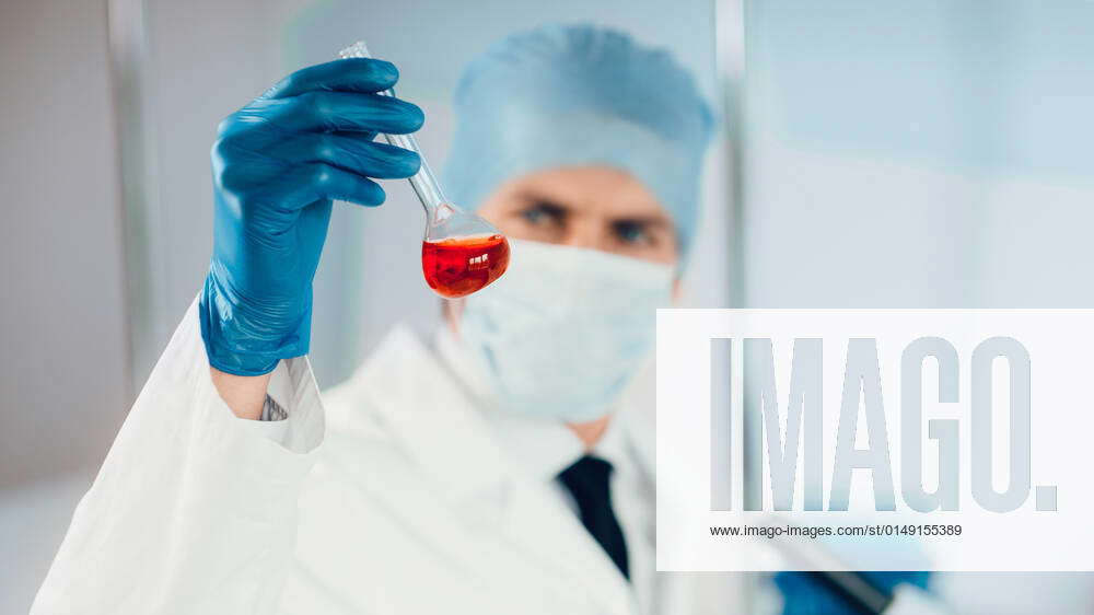 Close up. medical flask in the hands of a laboratory assistant. close ...