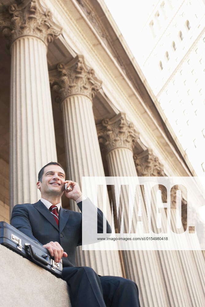 Lawyer Using mobile Phone Outside Courthouse, model released, , 9913148 ...