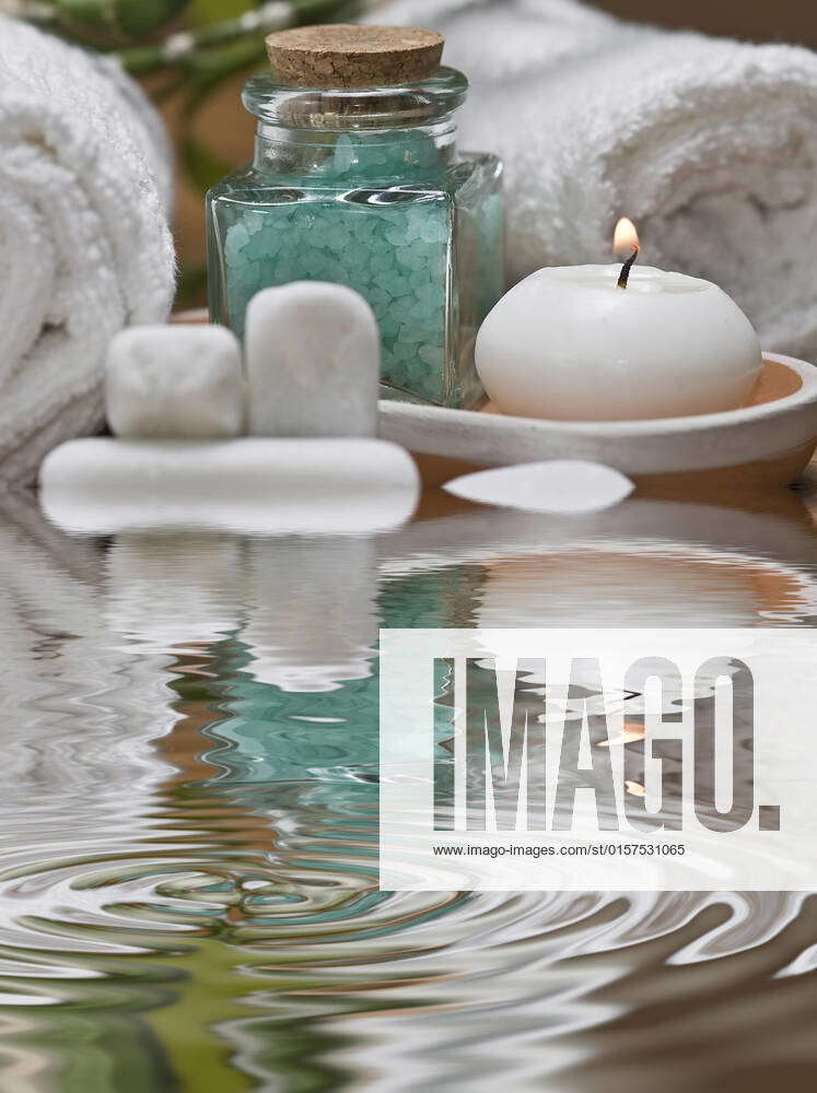 Spa Background With Bath Salts Towels And Candles On A Bamboo Mat