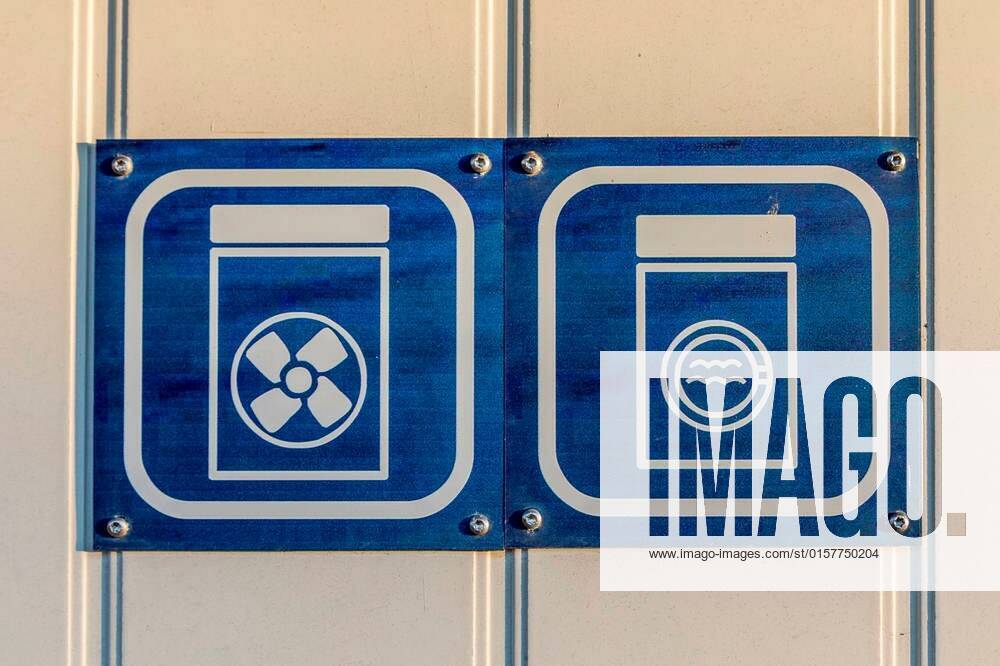 Signs showing illustration of washing machine and dryer, white and blue ...