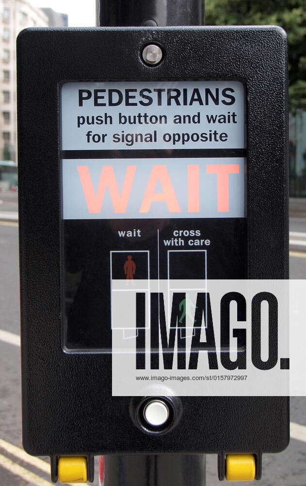 A pedestrian crossing sign - press button and wait for signal opposite ...