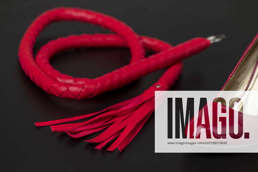 red whip and a high heel