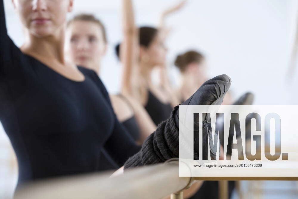 Young women practising at the barre, model released, property released ...