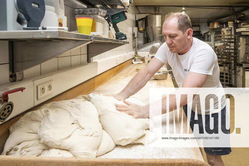 Illustration picture shows the baker s assistant preparing dough at the ...