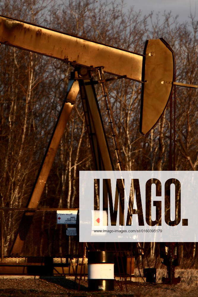 Oil pump near trees in Saskatchewan , 2011241, vertical, trees, warning ...
