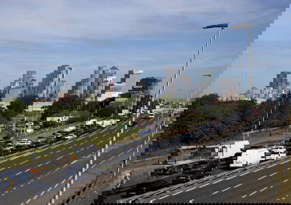 Traffic on the A102 driving towards the Blackwall Tunnel, the O2 and ...