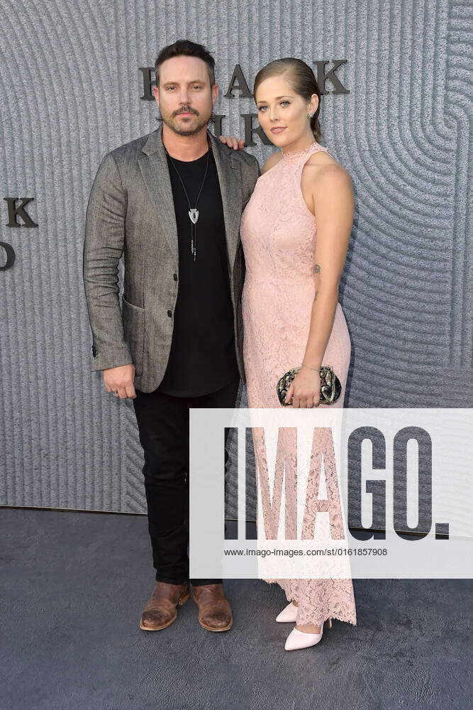 Michael Aaron Milligan and Karynn Moore at the premiere of the Apple TV ...