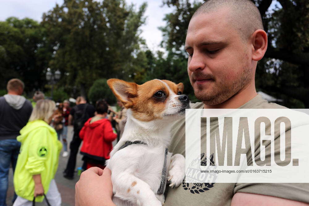 Odessa, Ukraine: A participant carries a dog in his hands during the ...