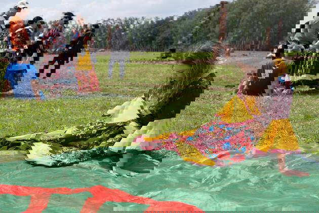 Brzezinka, Poland: Gypsy girls seen sitting on the grass at the former ...