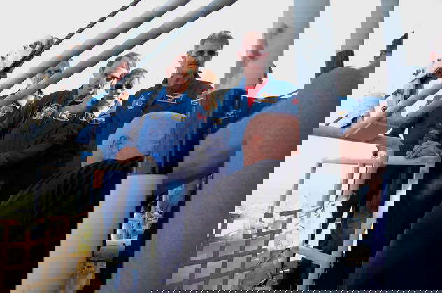 KENNEDY SPACE CENTER, Fla. -- The STS-88 crew get instruction from Ken ...