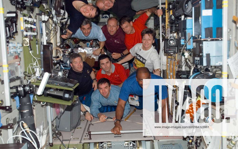 S122-E-009694 (17 Feb. 2008) --- The STS-122 and Expedition 16 crewmembers gather for a photo in