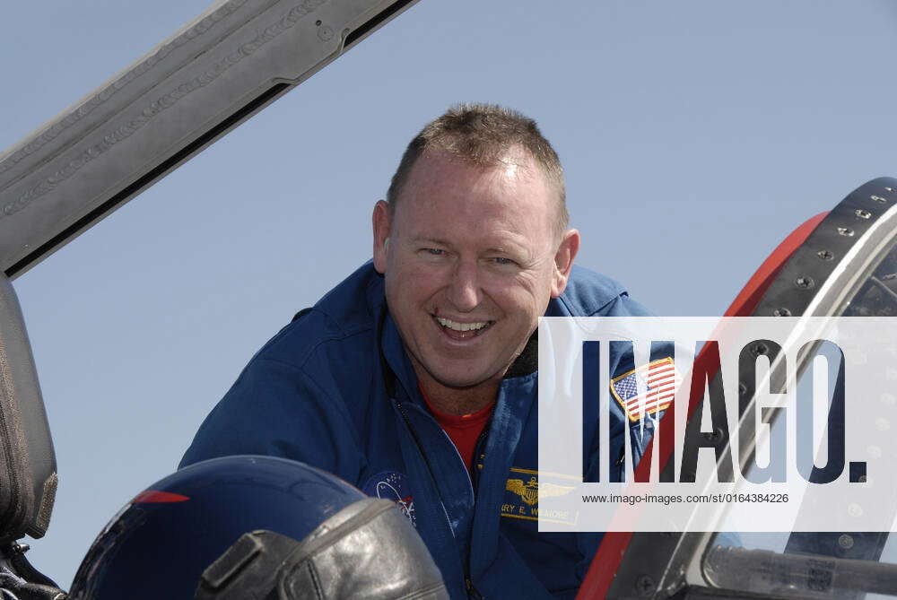 CAPE CANAVERAL, Fla. - STS-129 Pilot Barry E. Wilmore greets the camera ...